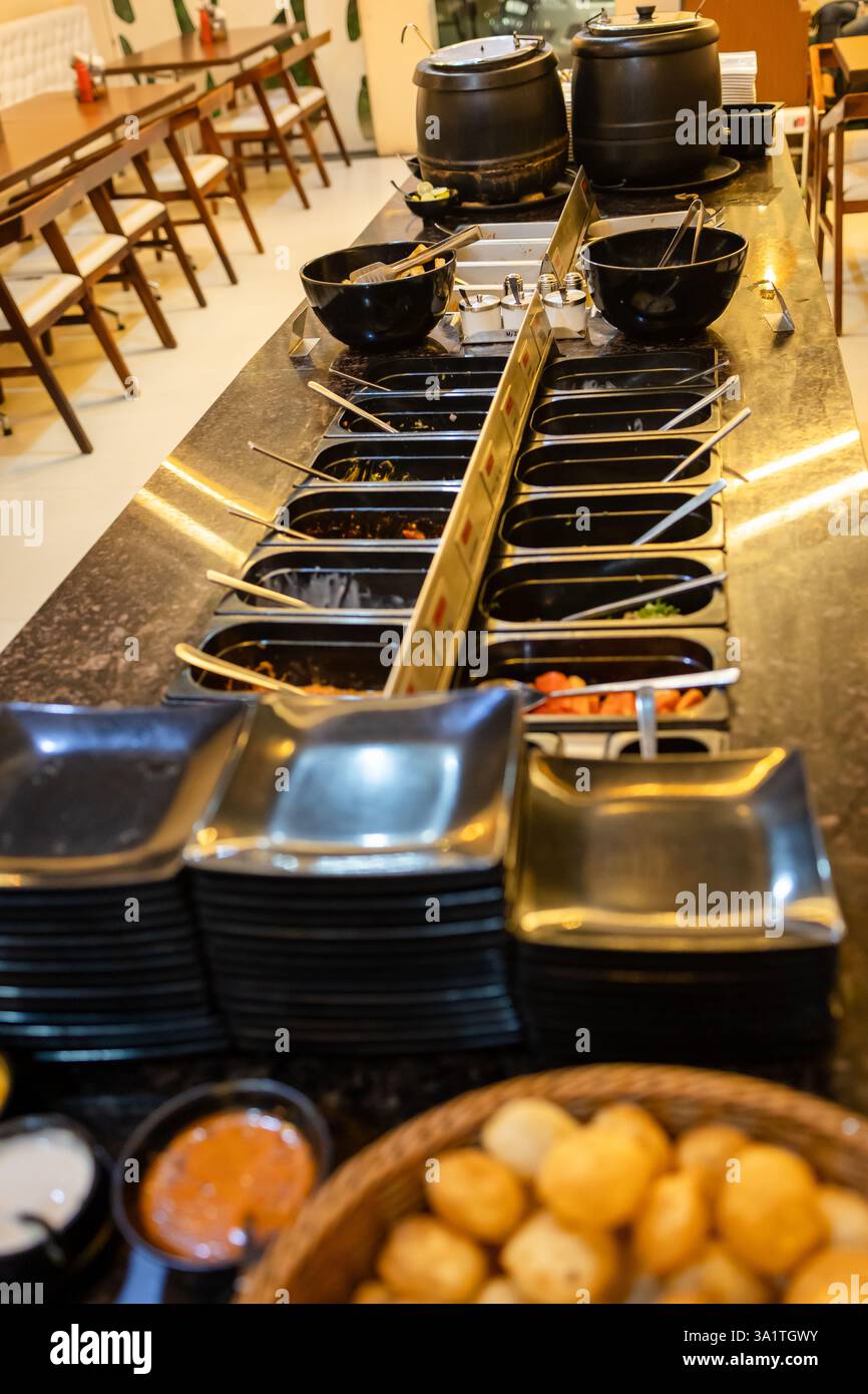 unlimited buffet counter with many items kept for self service at ...