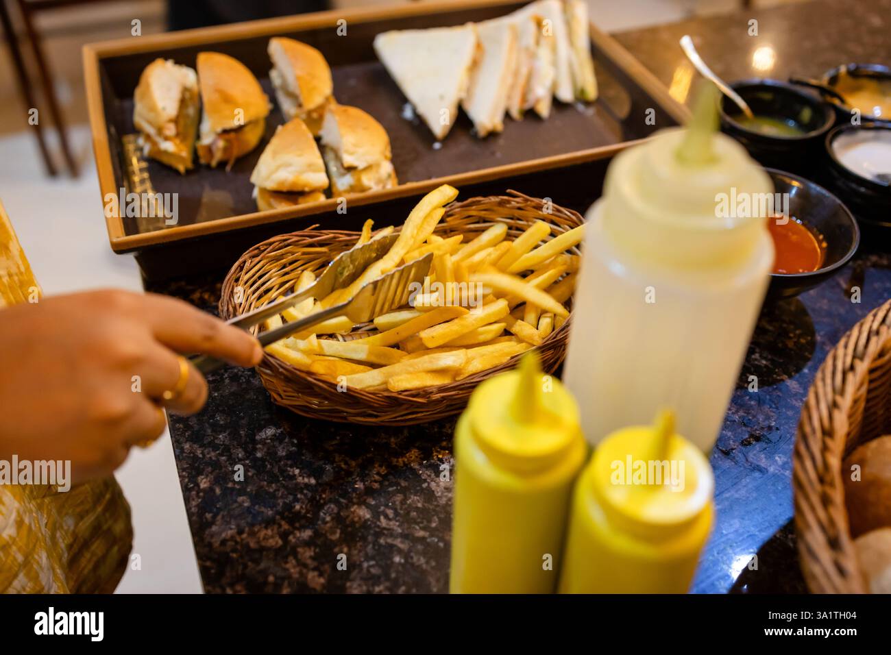 freshly prepared french fries ready to serve at indoors Stock Photo - Alamy