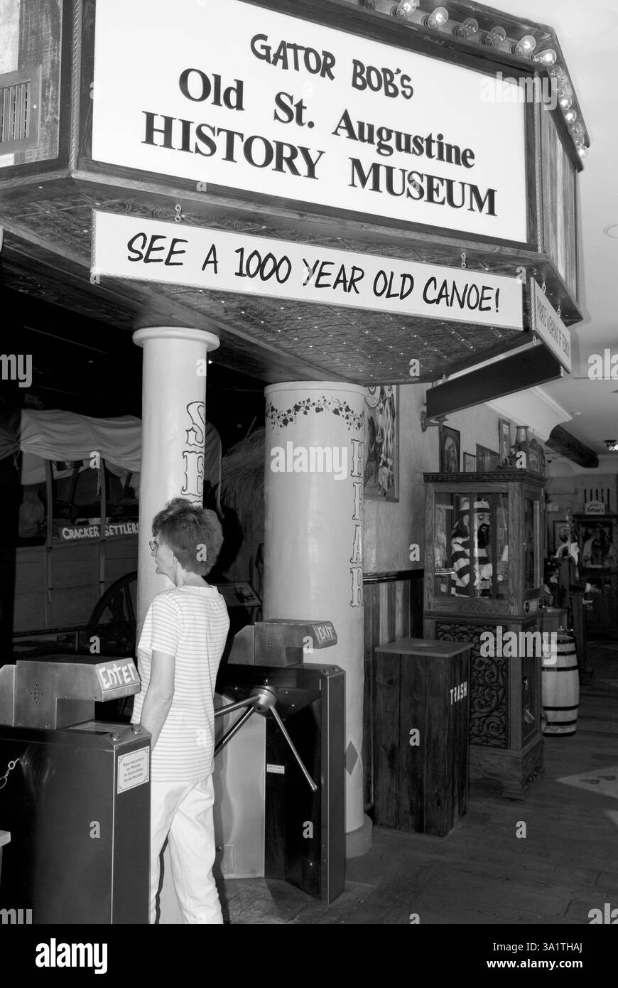 Caucasian female tourist stepping into the St. Augustine History Museum ...