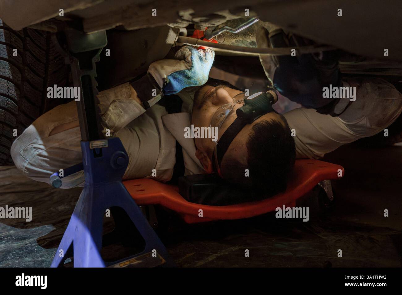 Professional Mechanic Wearing Safety Gear Inspecting and Repairing ...