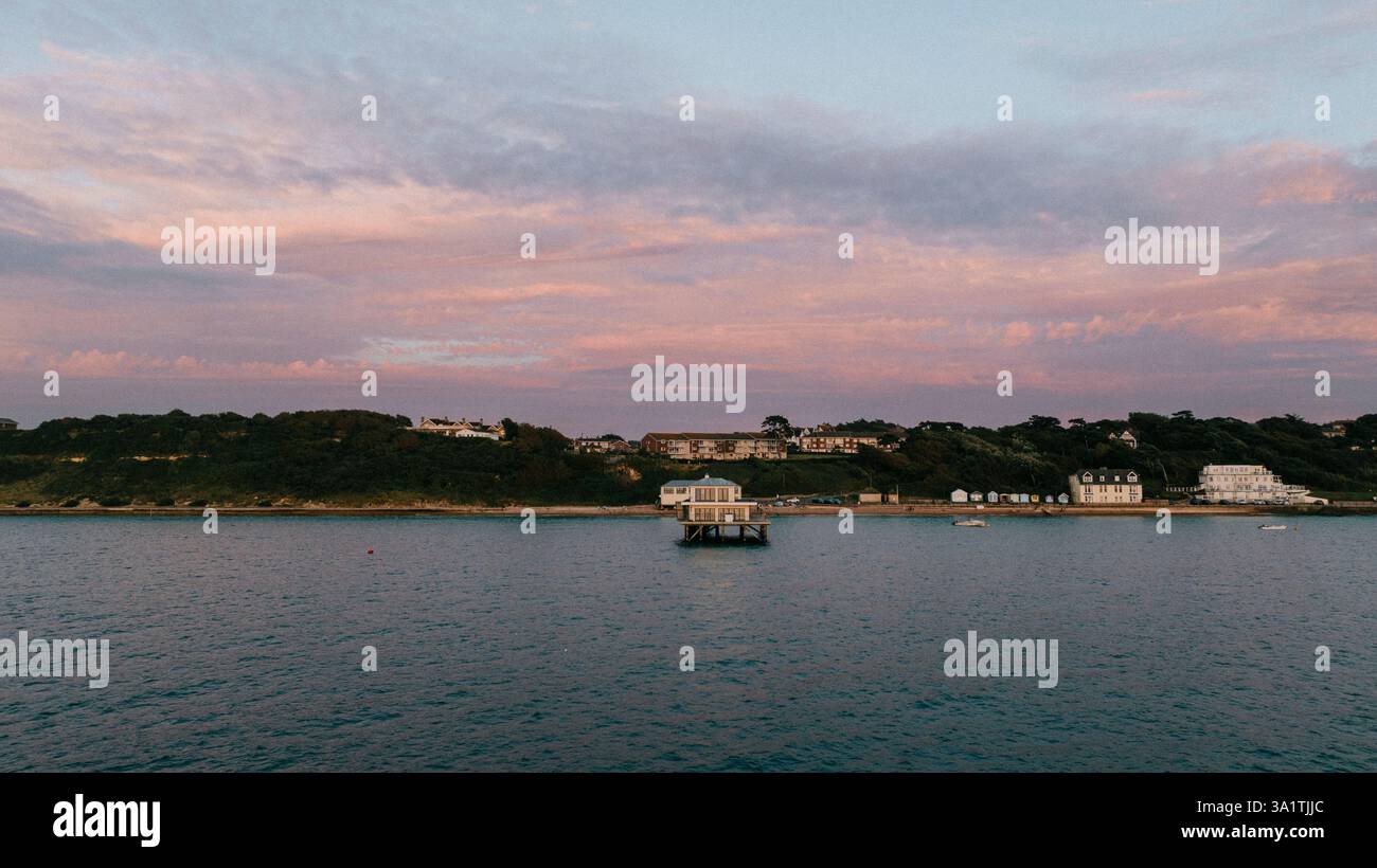 The Peer at Totland on a summers evening with a beautiful sunset Stock ...