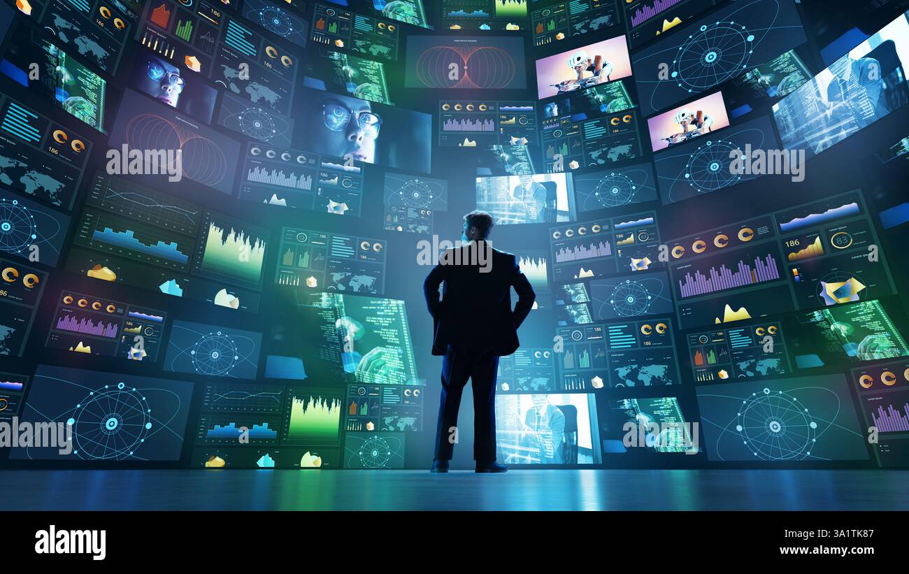Businessman analyzing real-time financial and technological data on immersive screen wall Stock ...