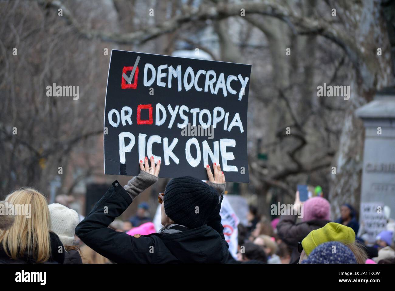 People holding signs at an International Women's Day march in New York ...