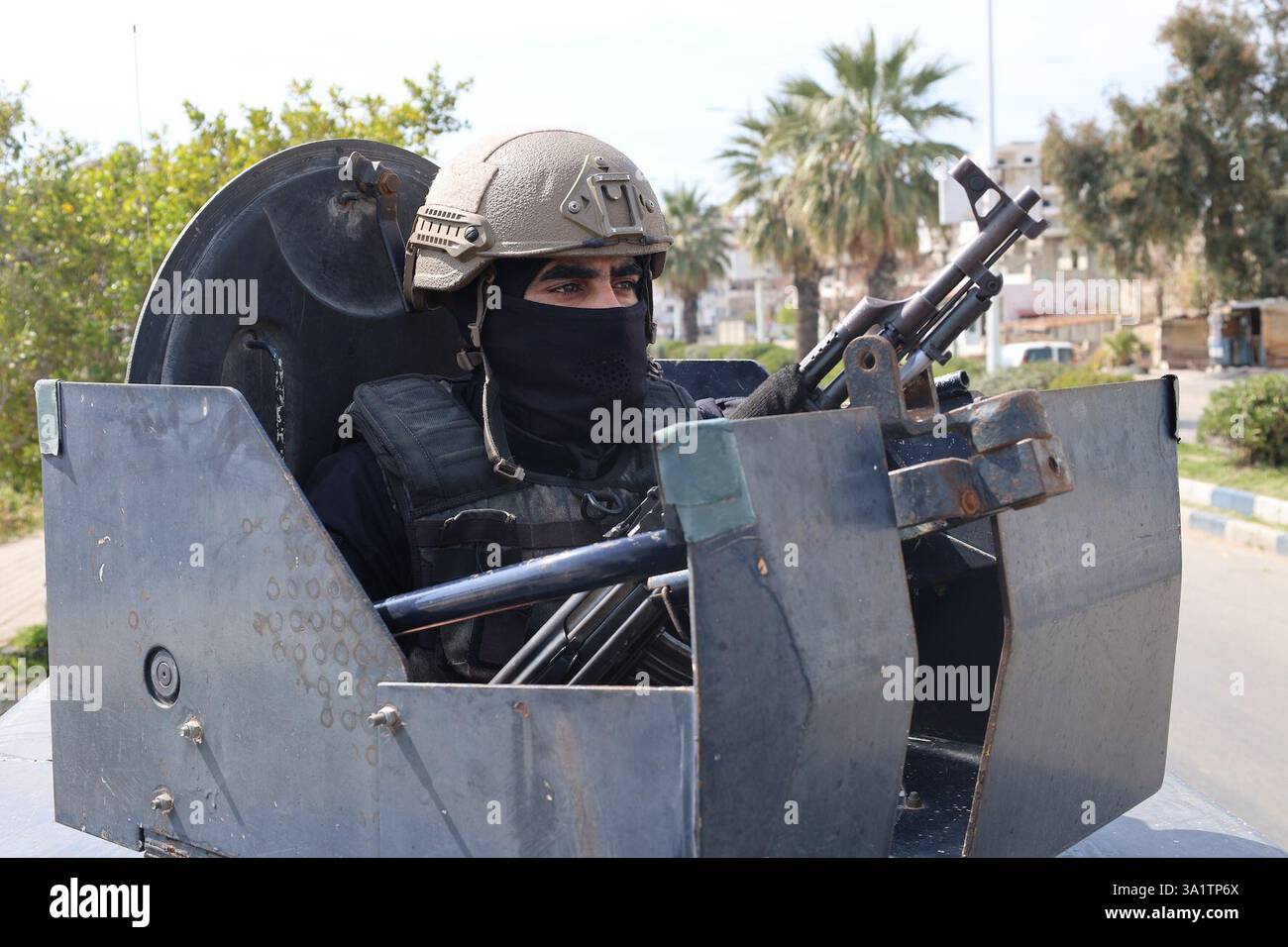 Jableh, Syria. 9th Mar, 2025. A member of the Syrian security forces ...