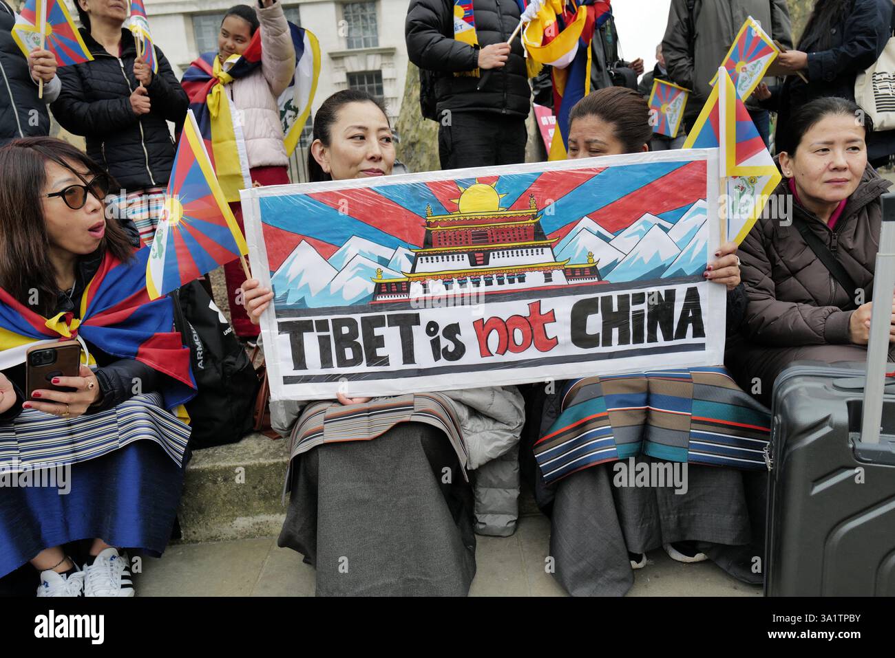 Protesters gather outside Downing Street to mark the 66th anniversary ...