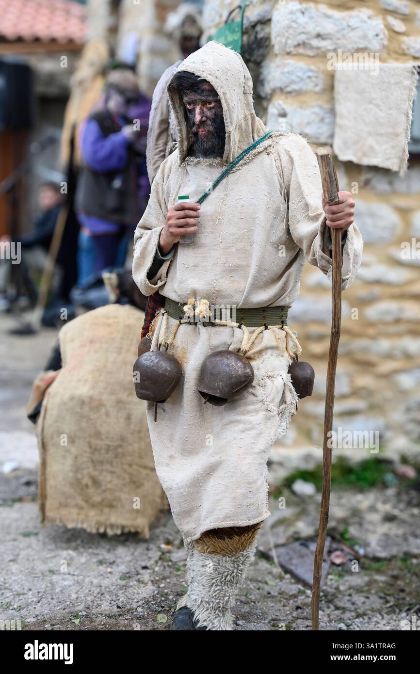 A participant dressed as a shepherd with soot blackend face, at a ...