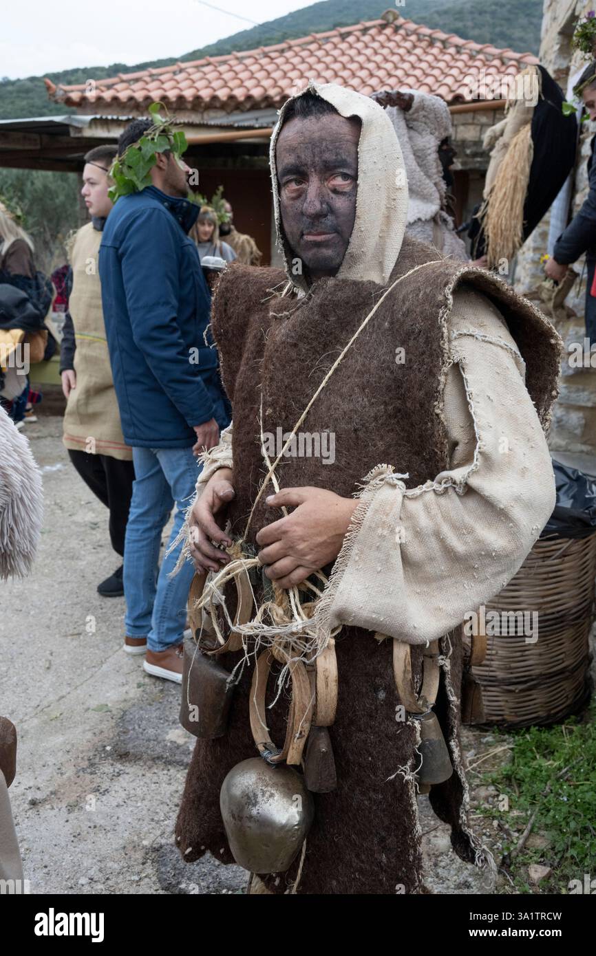 A participant dressed as a shepherd with soot blackend face, at a ...