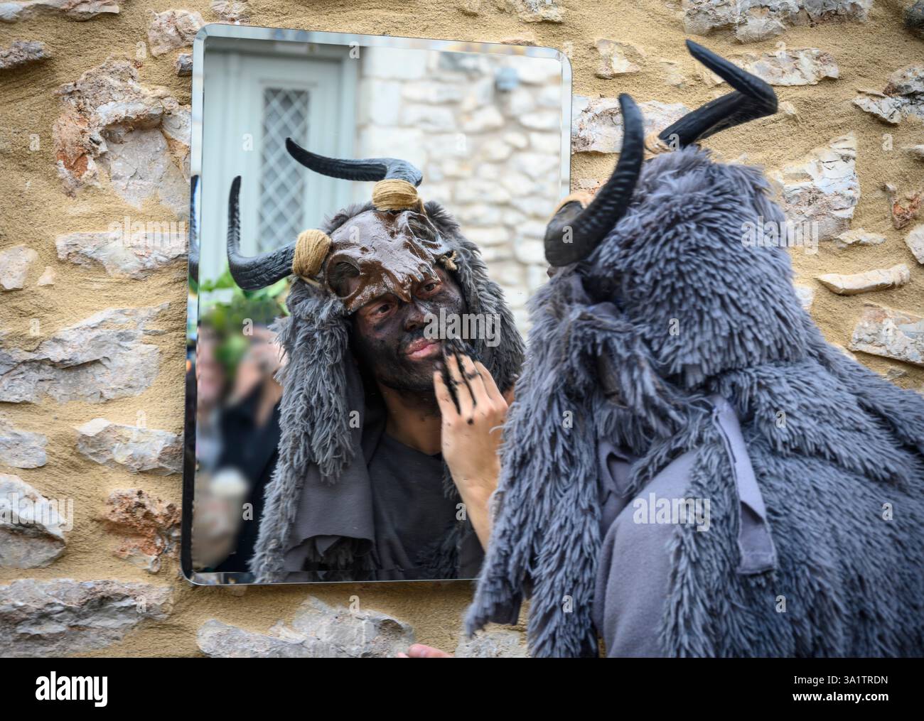 A participant at a rights of spring festival, dressed as a goat ...