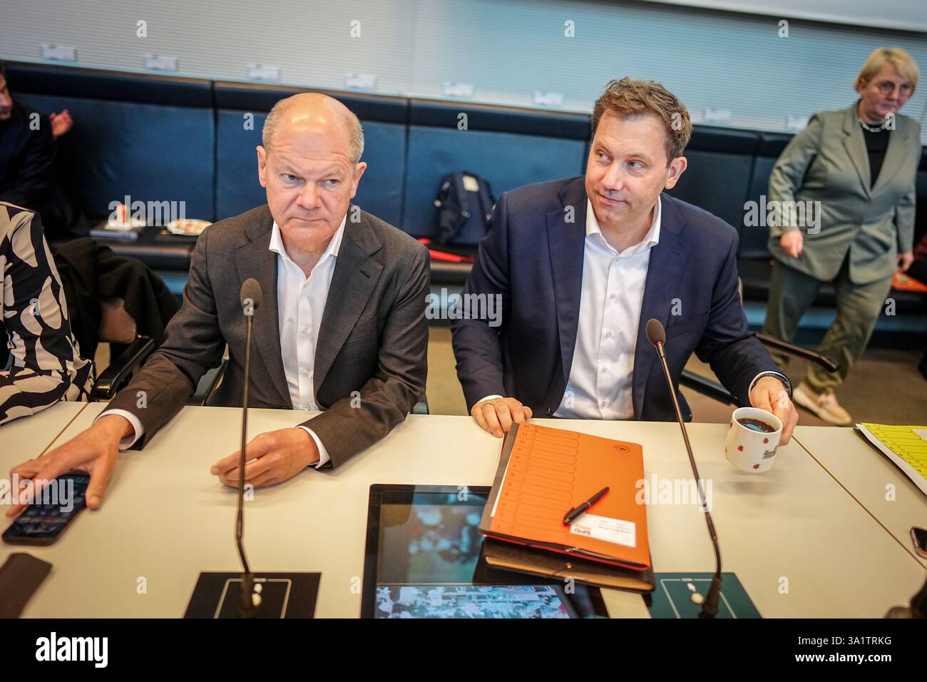 10 March 2025, Berlin: Federal Chancellor Olaf Scholz (l, SPD), and ...