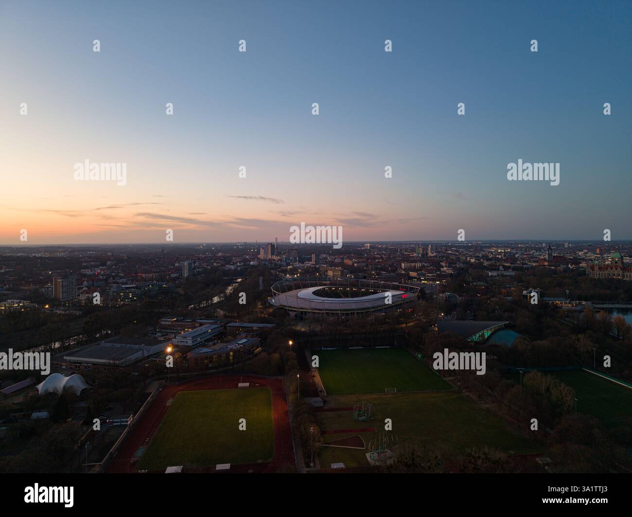 A breathtaking aerial view that showcases a sprawling cityscape bathed ...
