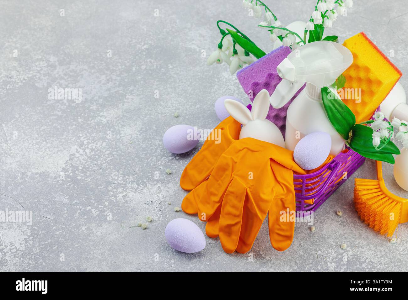 Easter cleaning house concept. Housekeeping supplies, bottles, tools ...
