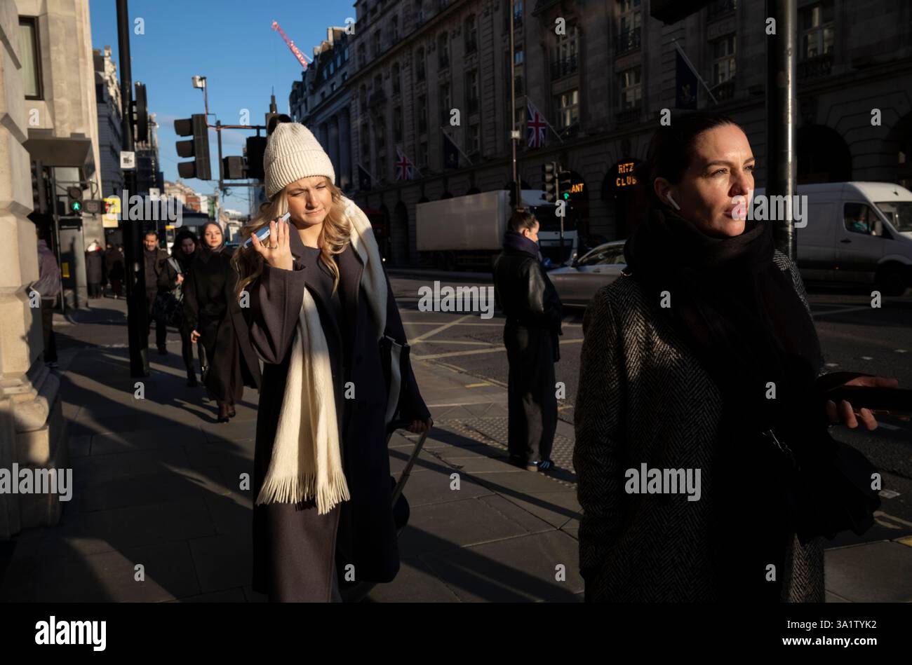 Pedestrians along Piccadilly, in the heart of the Mayfair district in London, enjoying the ...