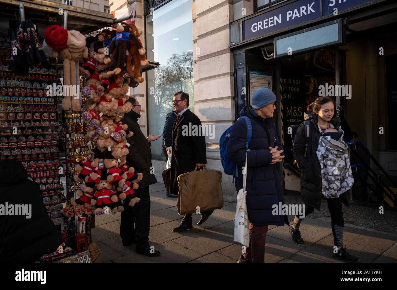 Businessmen go about their lives outside Green Park Underground Station, situated on Piccadilly ...
