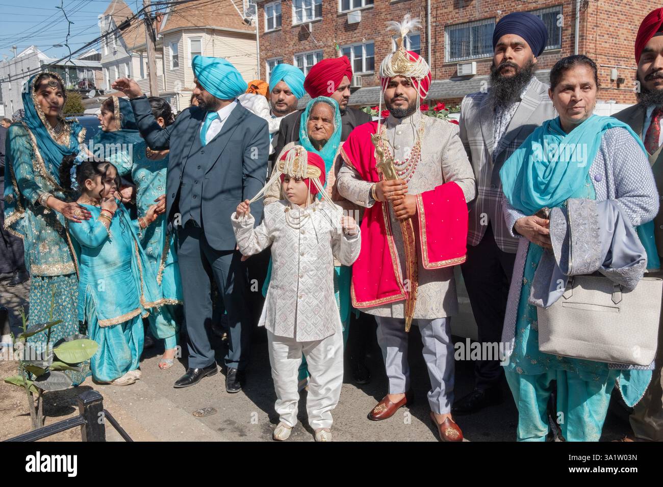 Upon arrival to his Sikh temple, a groom poses with friends and family ...