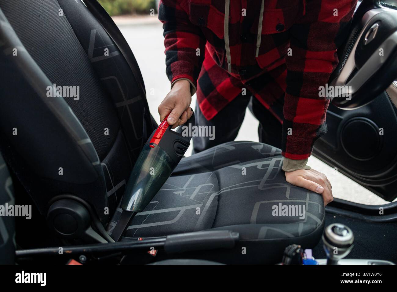 Cleaning the interior of the car with a vehicle vacuum cleaner Stock ...