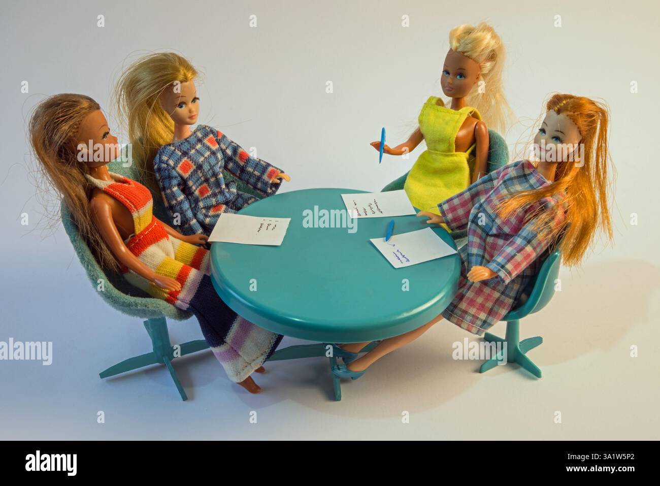 Four1970s Palitoy Pippa Dolls, sat around a table a table in a work ...