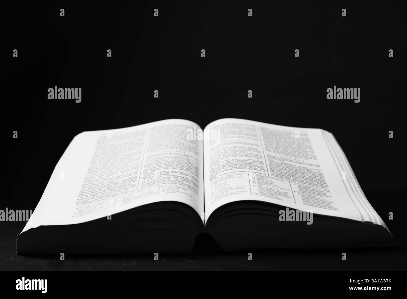 Open Holy Bible in English language on black table, closeup Stock Photo ...
