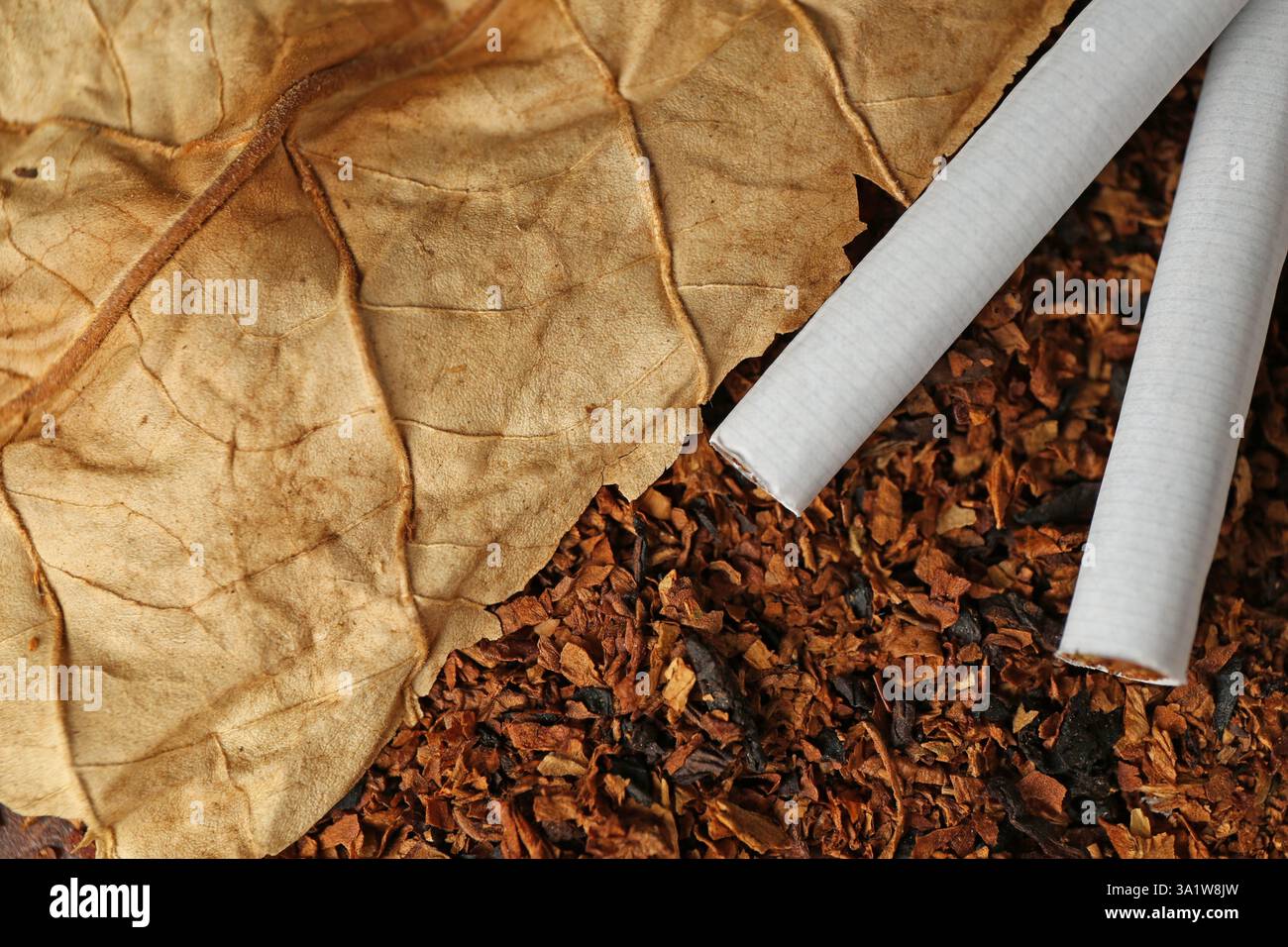 Tobacco, dried leaf and cigarettes as background, closeup Stock Photo ...