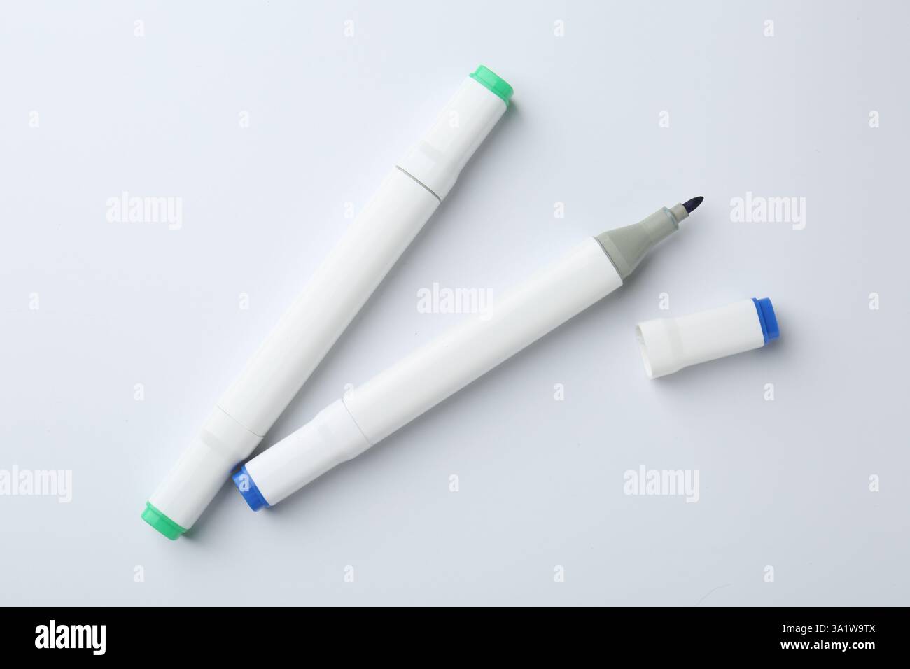 Colorful double sided markers on white background, flat lay Stock Photo ...