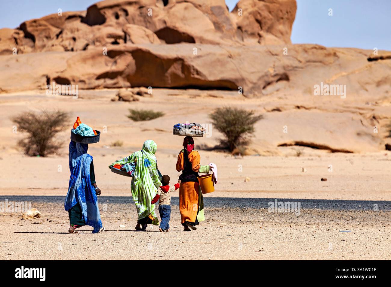 Women are cleaning and washing clothes in the sahara desert Stock Photo ...