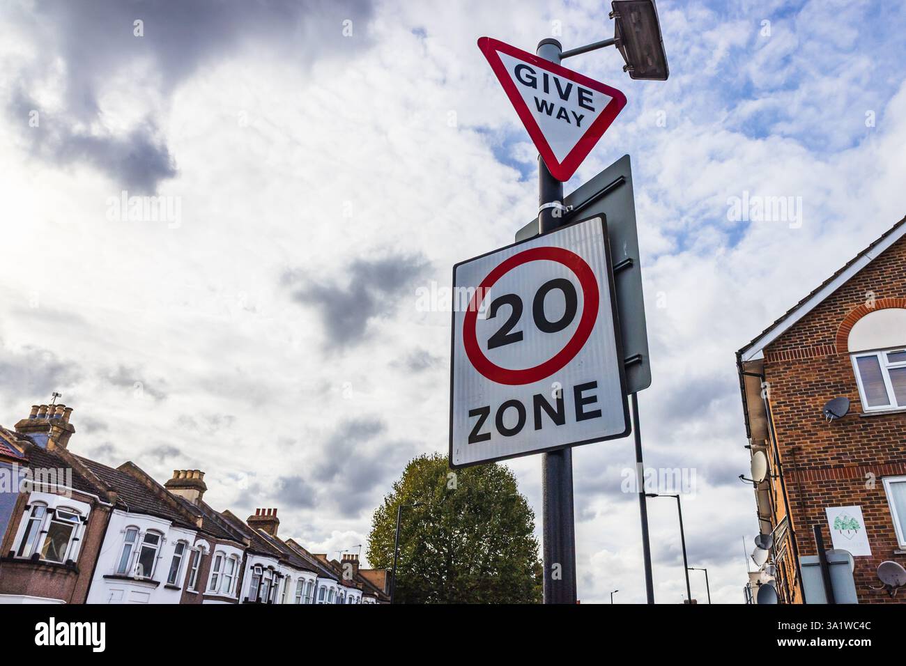 Urban 20 MPH Speed Limit Zone Sign with Give Way Warning Stock Photo ...