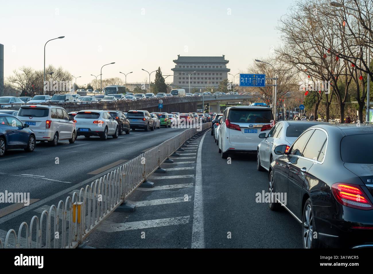 Heavy traffic in front of an old city gate in downtown Beijing, China ...
