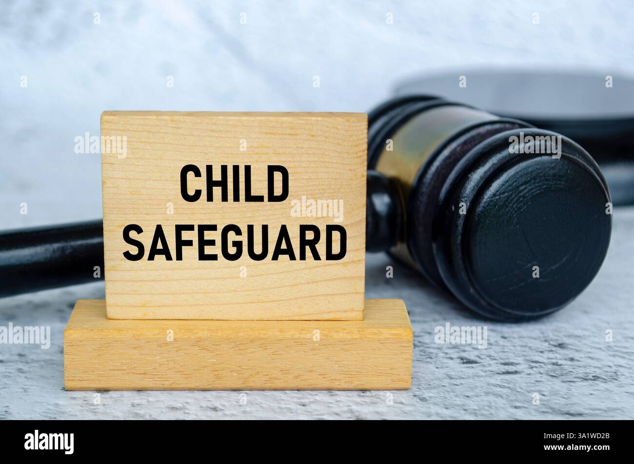 Child Safeguard text on wooden blocks with gavel background. Child ...