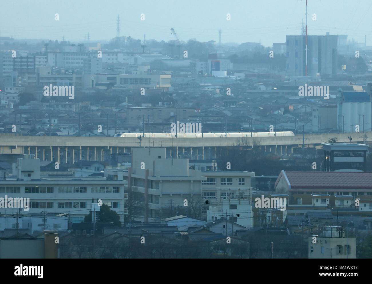 A photo shows Hokuriku Shinkansen (bullet train) running through ...