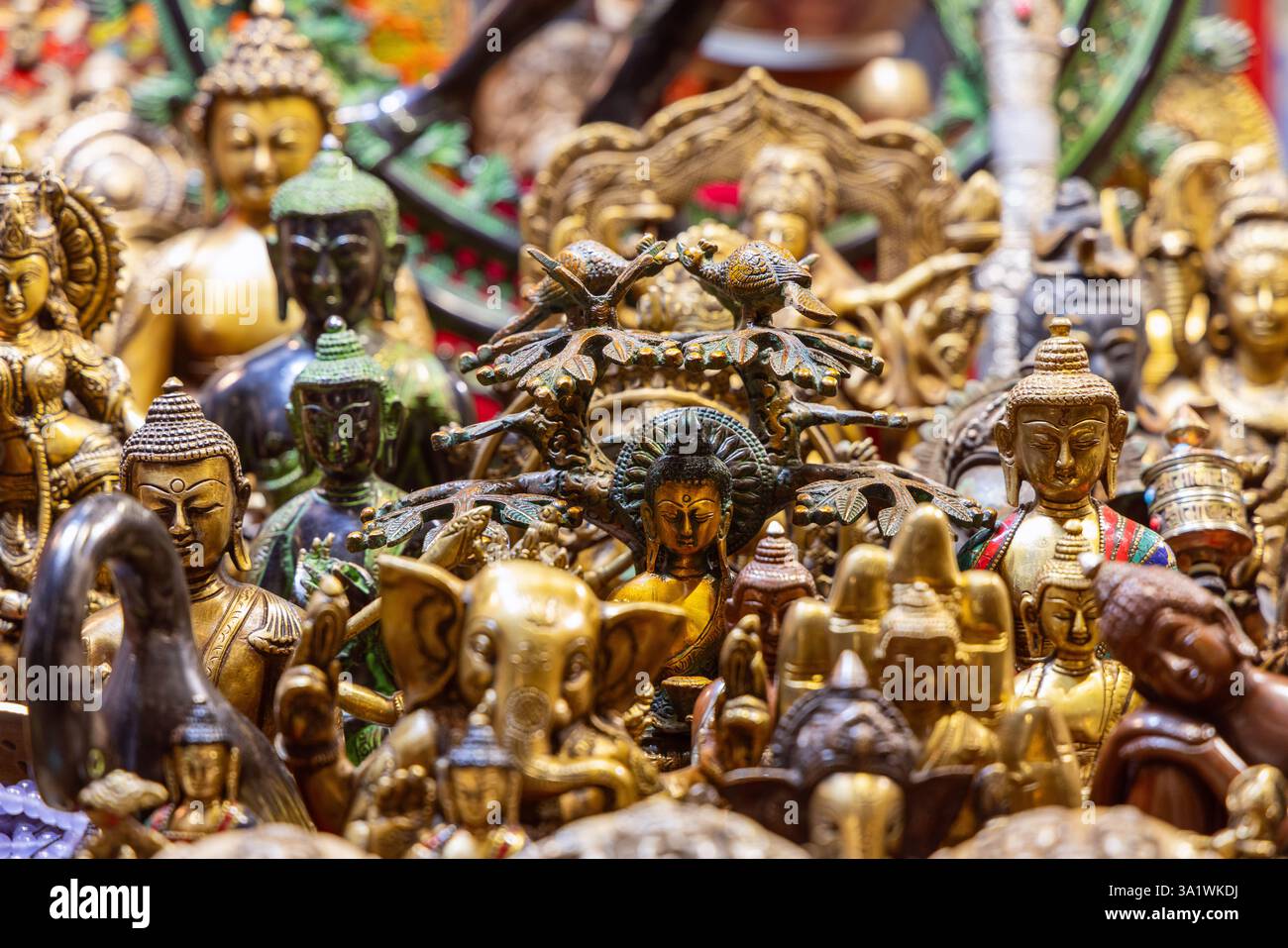 Dense display of Hindu and Buddhist deity statues crafted from metal ...