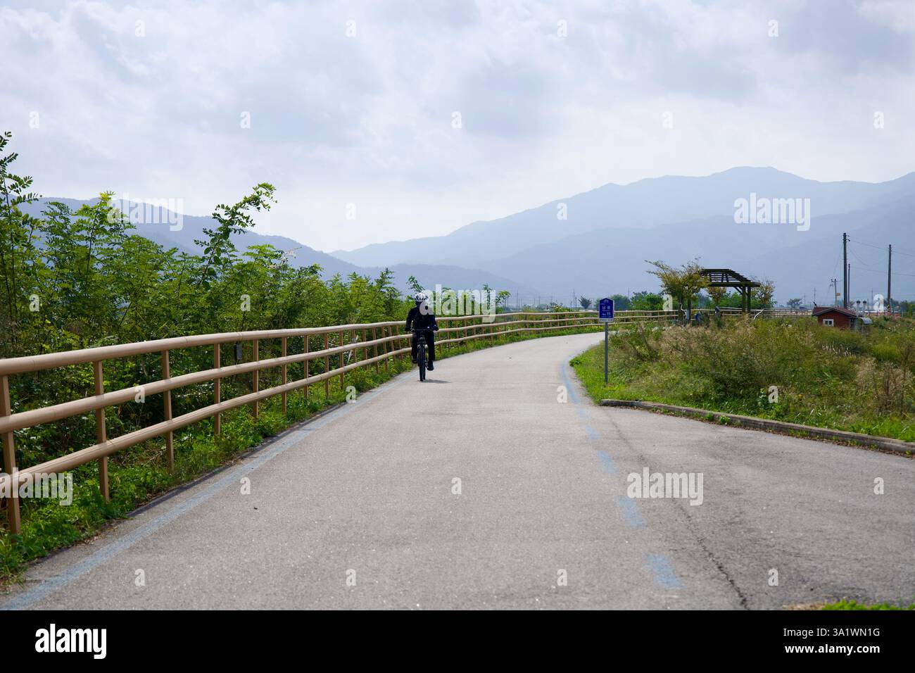 Namwon City, South Korea - October 3rd, 2021: A lone cyclist rides ...
