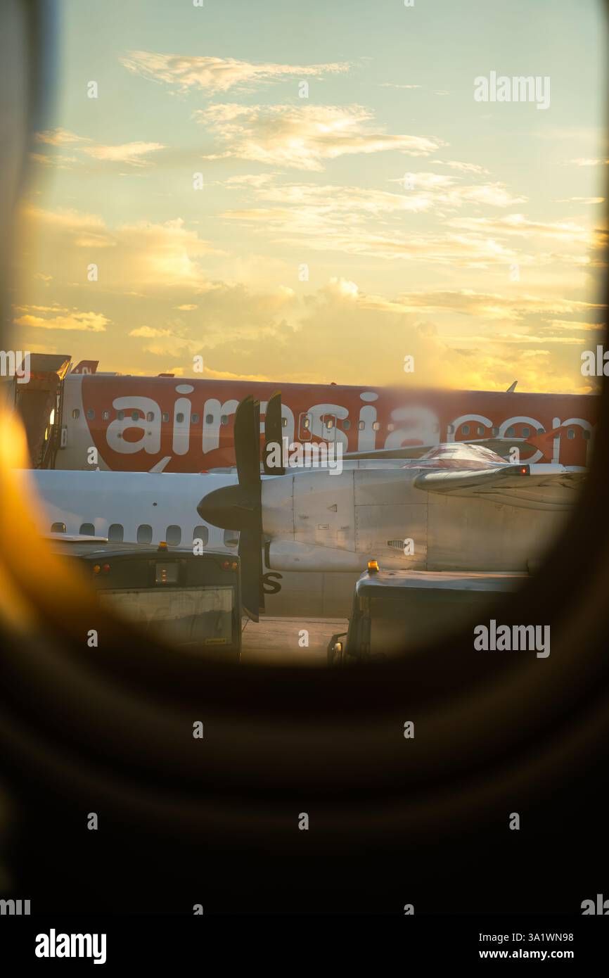 Aeroplane window view of two airbuses including AirAsia Stock Photo - Alamy