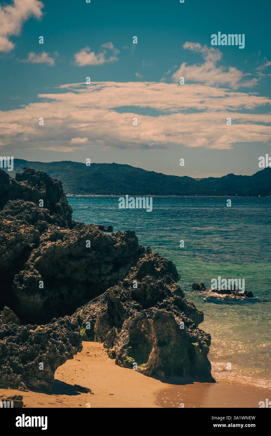 tropical shallow waters and coral rocks at white beach, boracay ...