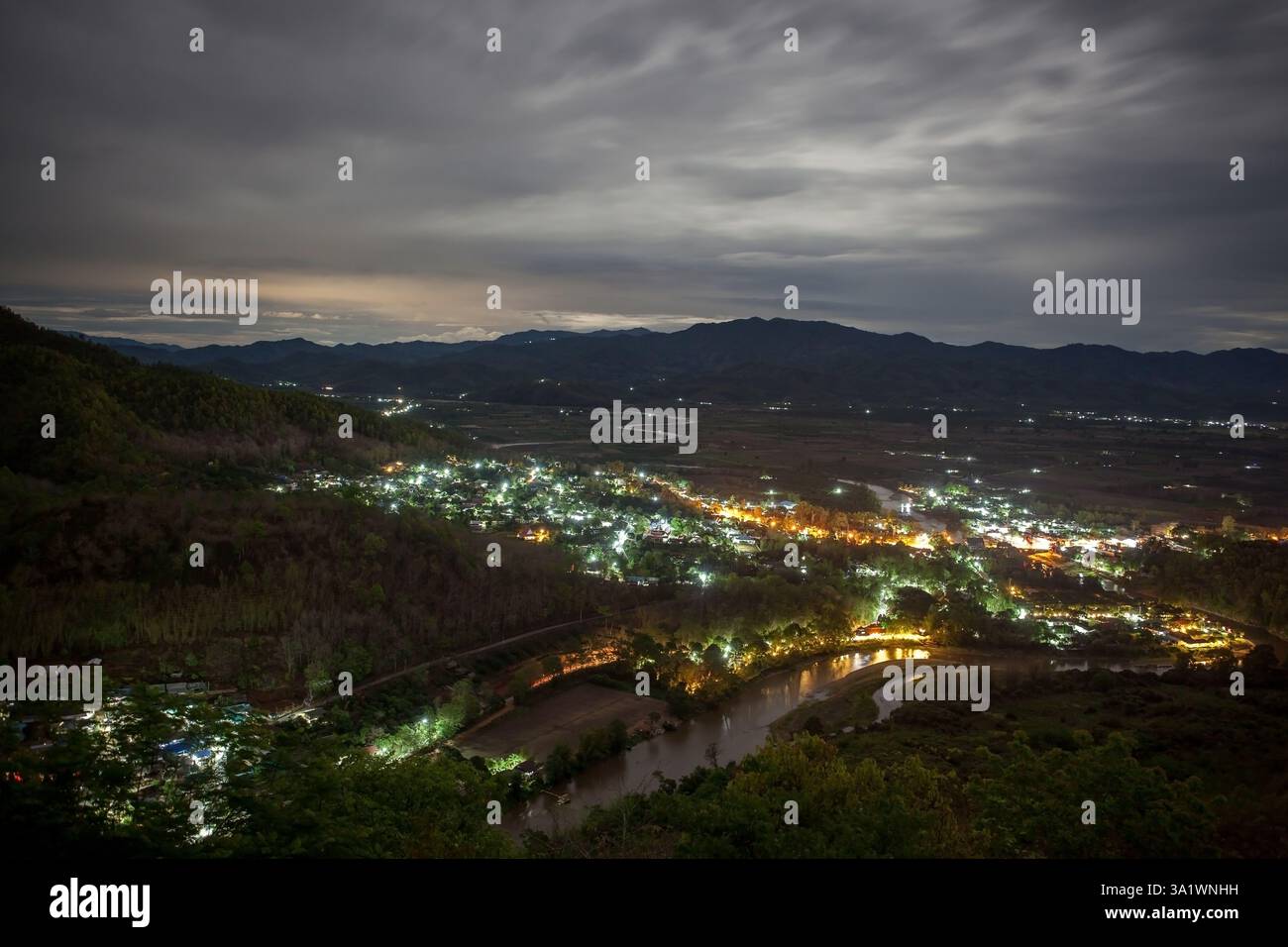 Thaton village illuminated at night, view from above. Chiang Mai ...