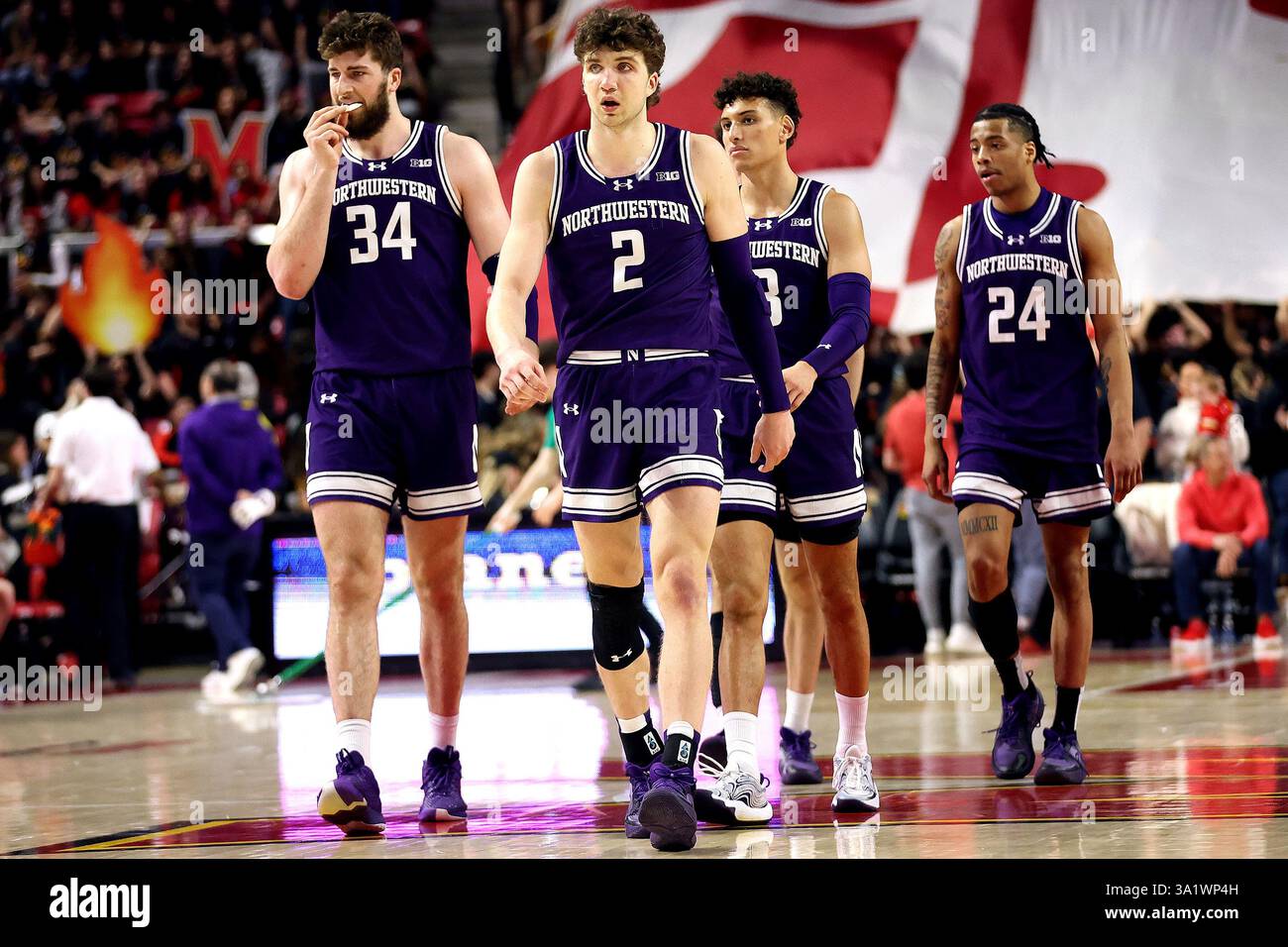 Northwestern players walk onto the court during the second half of an ...