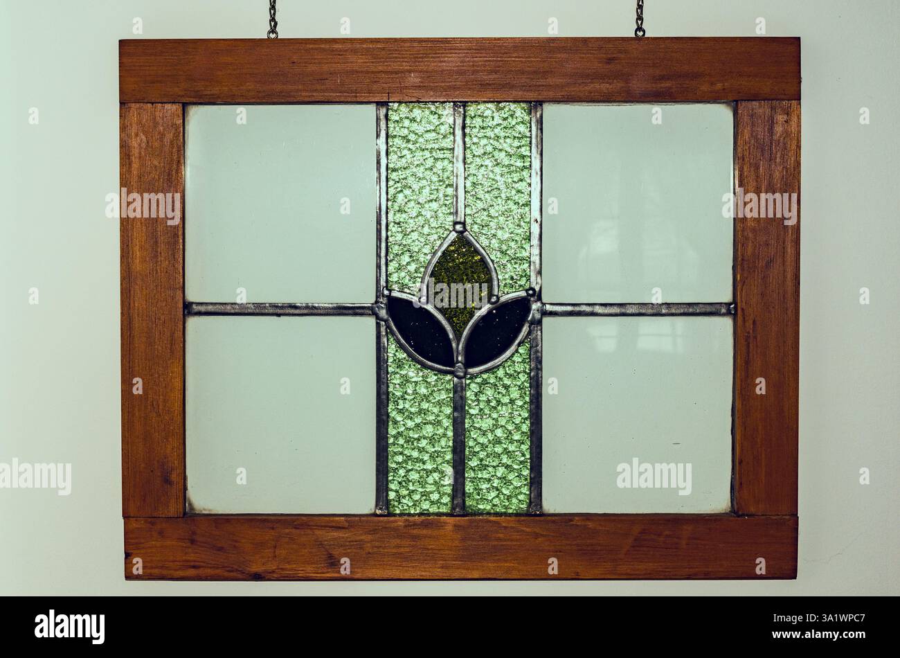 Wooden framed English stained glass window with green and red glass ...