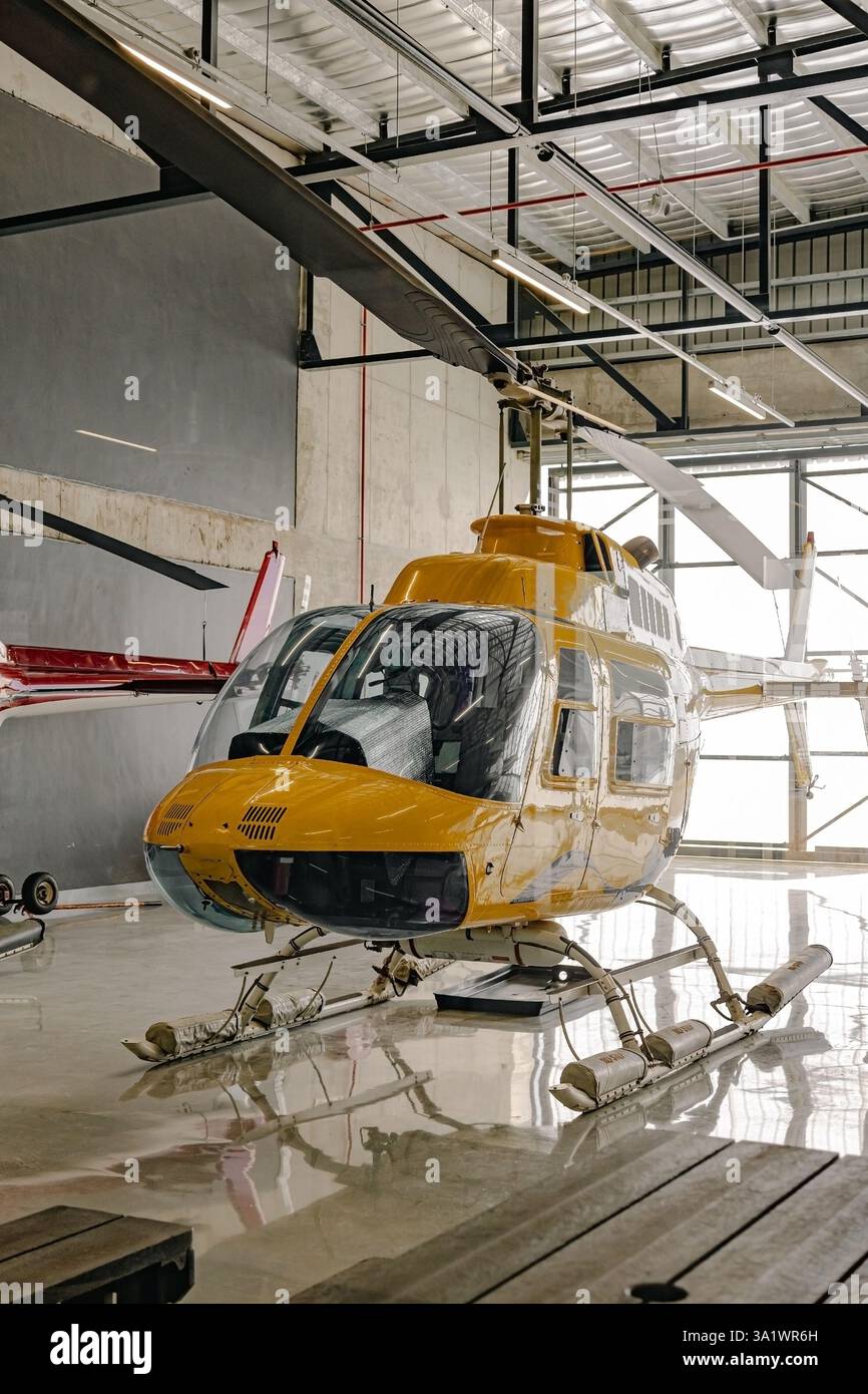 Yellow tourist helicopter in hangar, rotary-wing aircraft Stock Photo ...