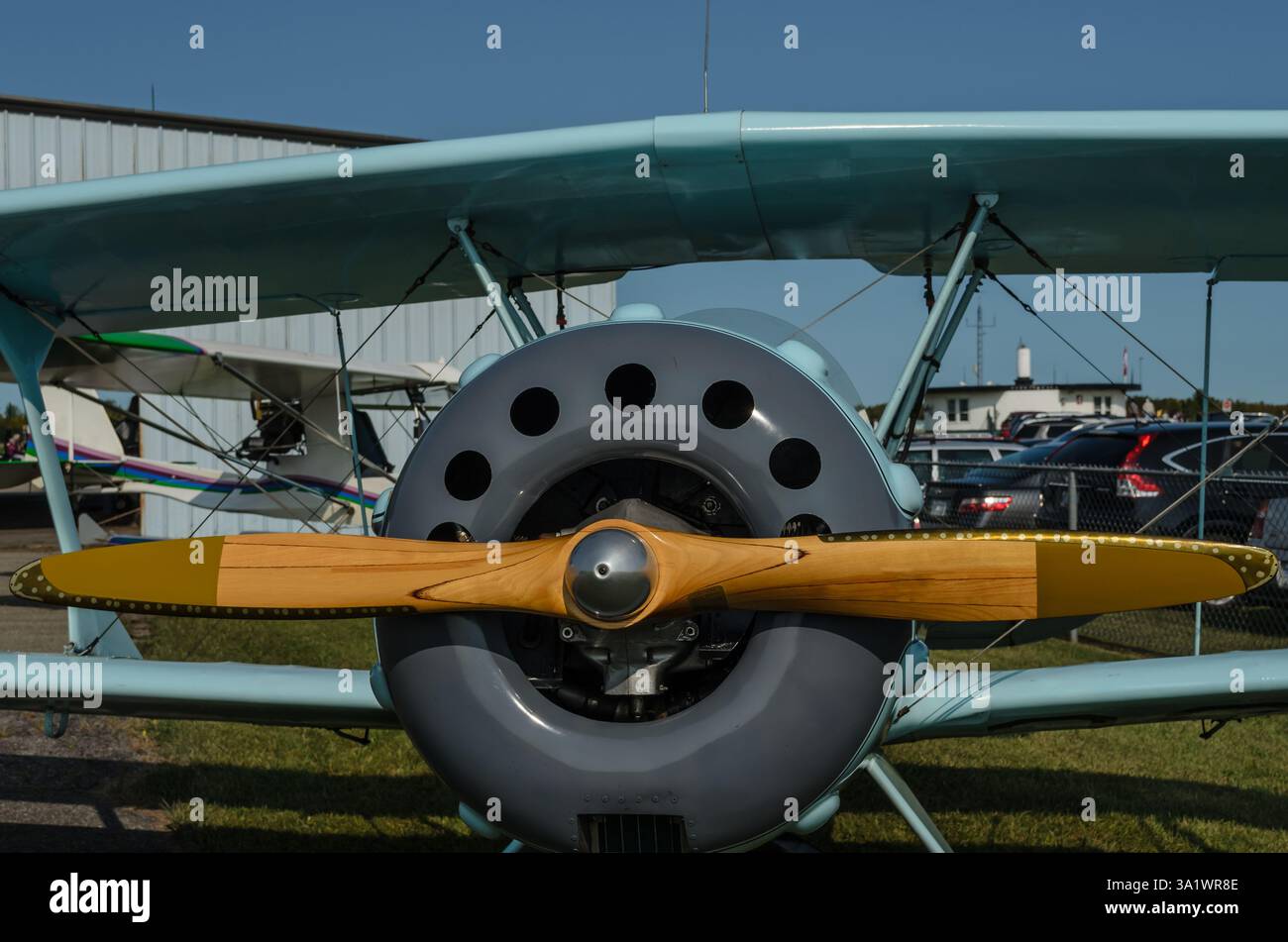 Close-up of a blue bi-plane's wooden propeller Stock Photo - Alamy