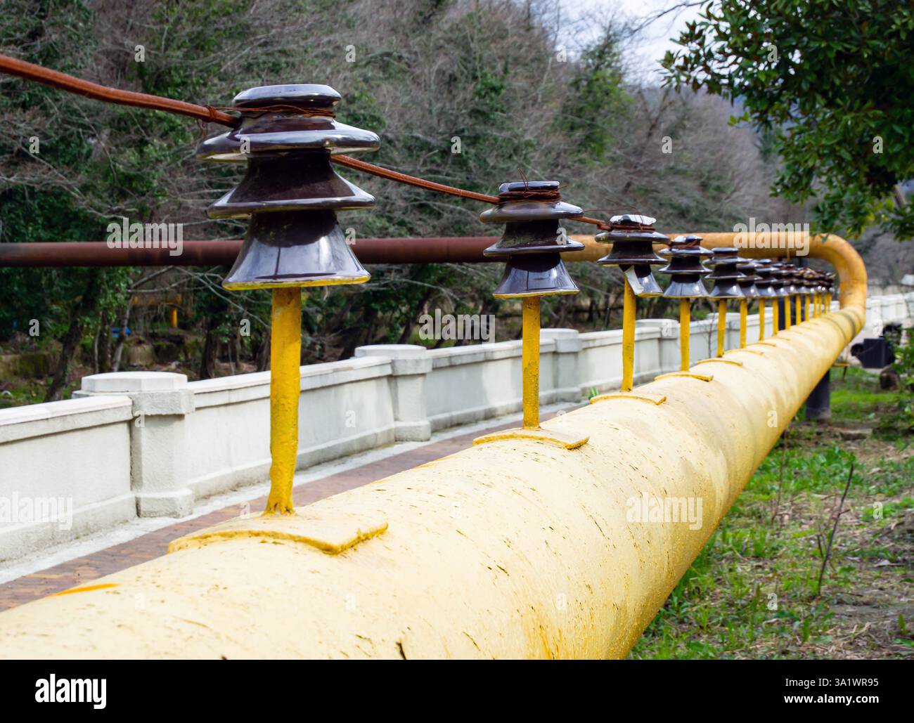 A long metal rod on insulators, fixed over the main gas pipe Stock ...