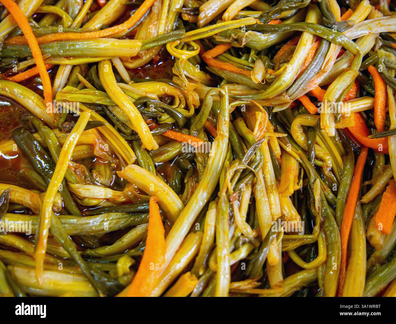 Pickled wild garlic in a container with brine Stock Photo - Alamy