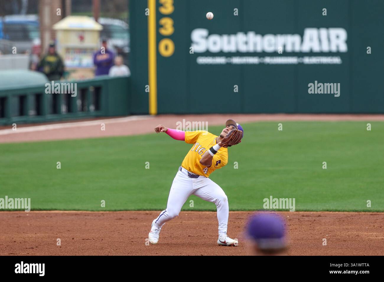 March 9, 2025: LSU's Steven Milam (4) looks a fly ball into his glove ...