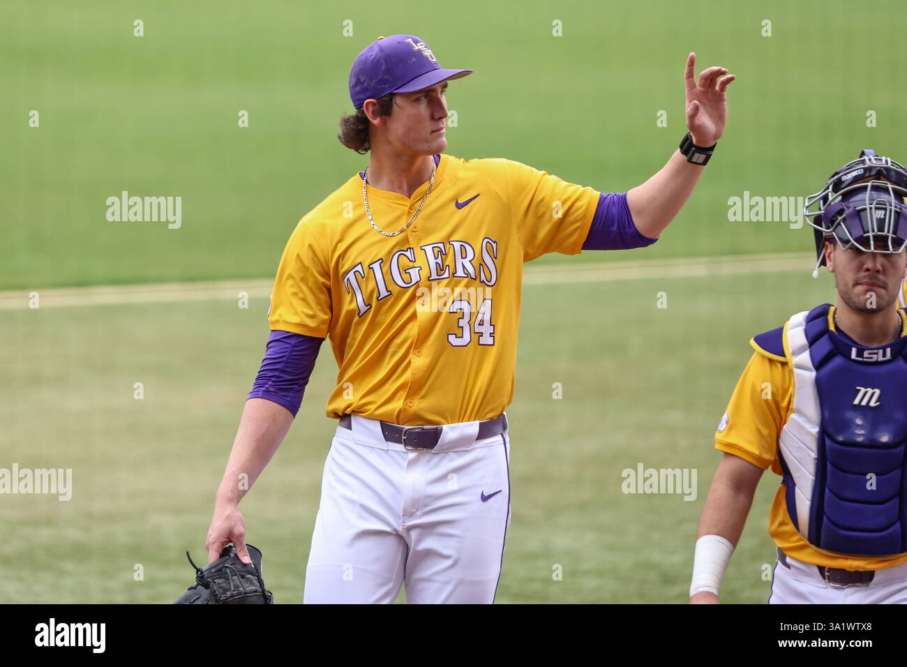 March 9, 2025: LSU starting pitcher Chase Shores (34) waves to the ...