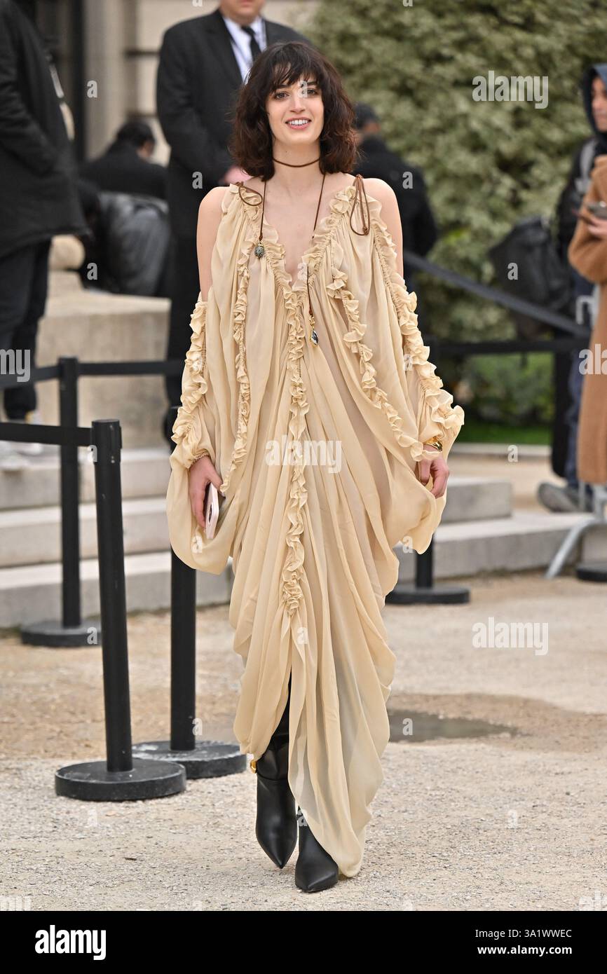 Guest arriving at Zimmerman show during Paris Fashion Week in Paris ...