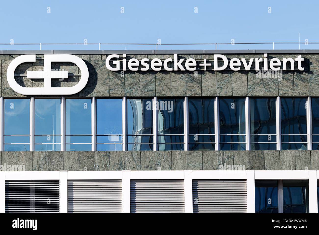 09 March 2025, Bavaria, Munich: The logo and lettering of Giesecke+Devrient GmbH (G+D) can be ...