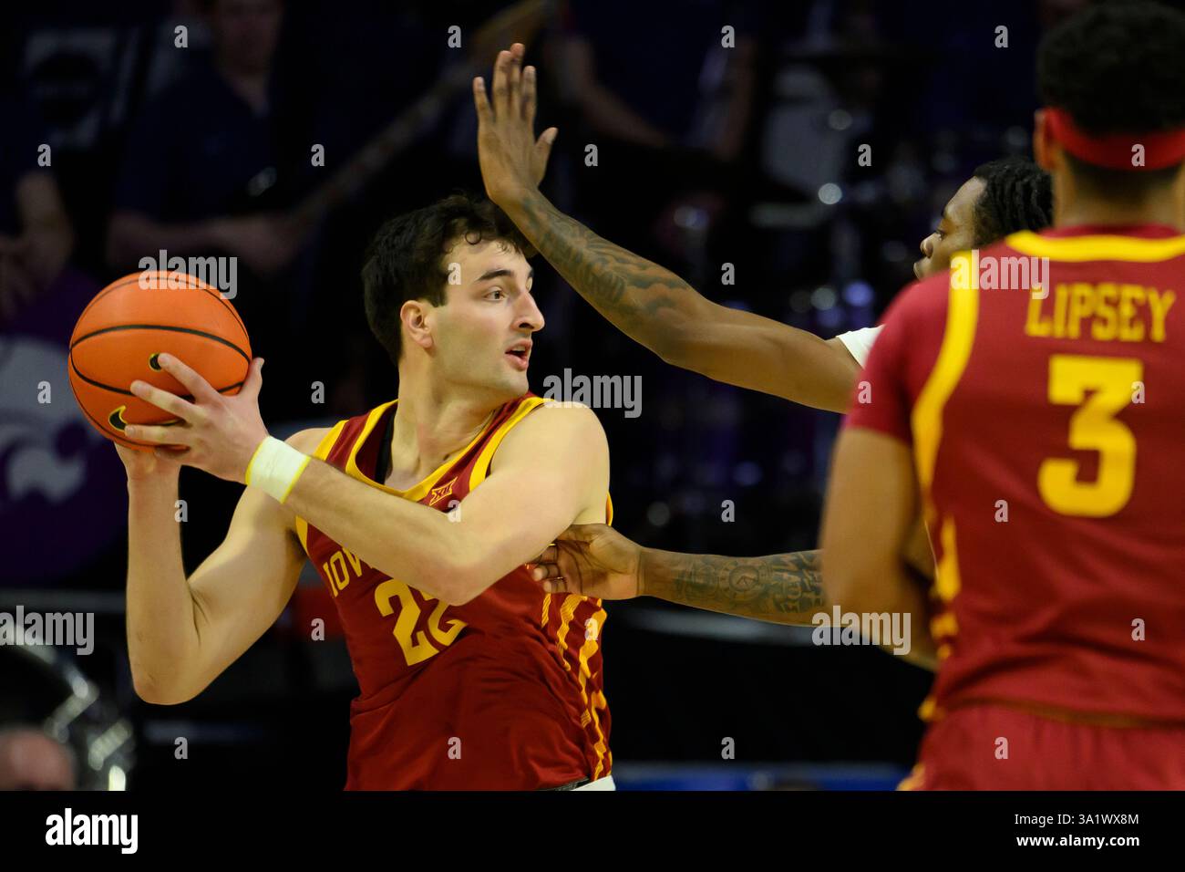 Iowa State forward Milan Momcilovic (22) looks to pass while being ...