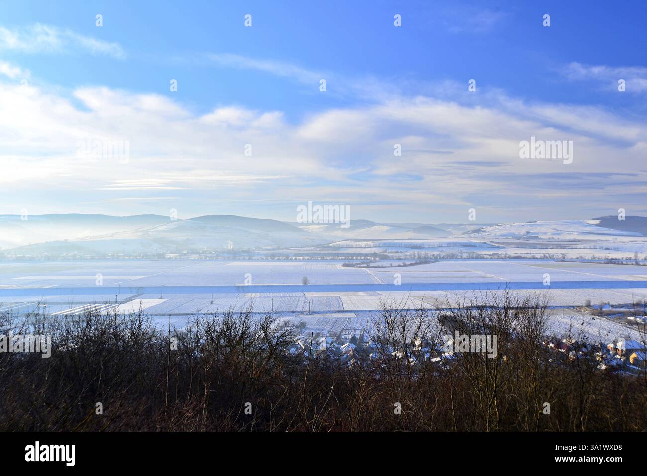 Snow clouds and blue sky in the valley of Tarnava Mica on the European ...