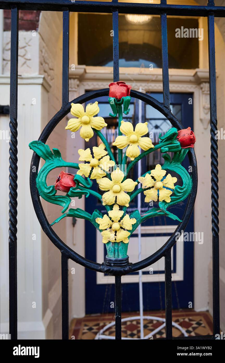 Floral design in wrought iron gate Stock Photo - Alamy