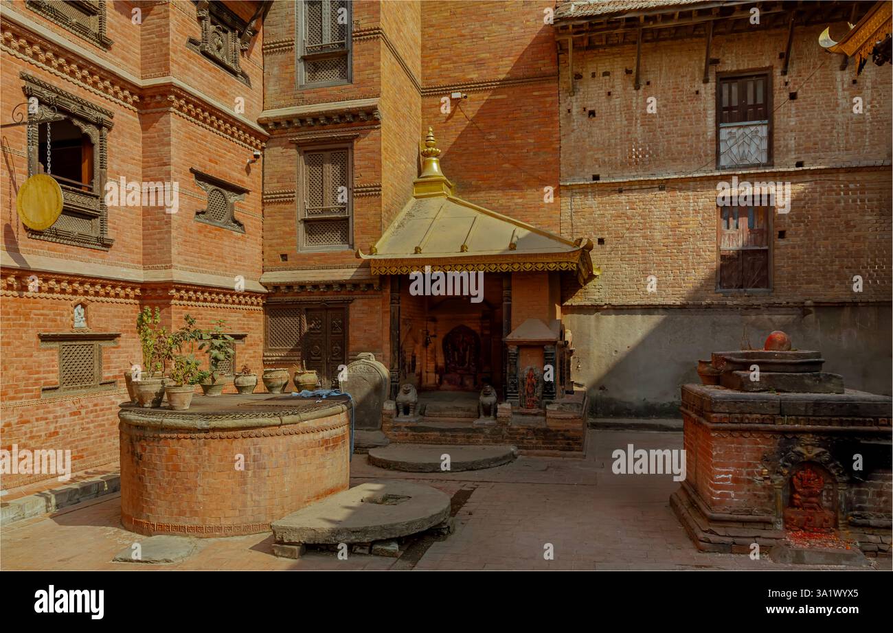 Bhaktapur, Nepal - February 10th 2025 -A court yard with Buddhist ...