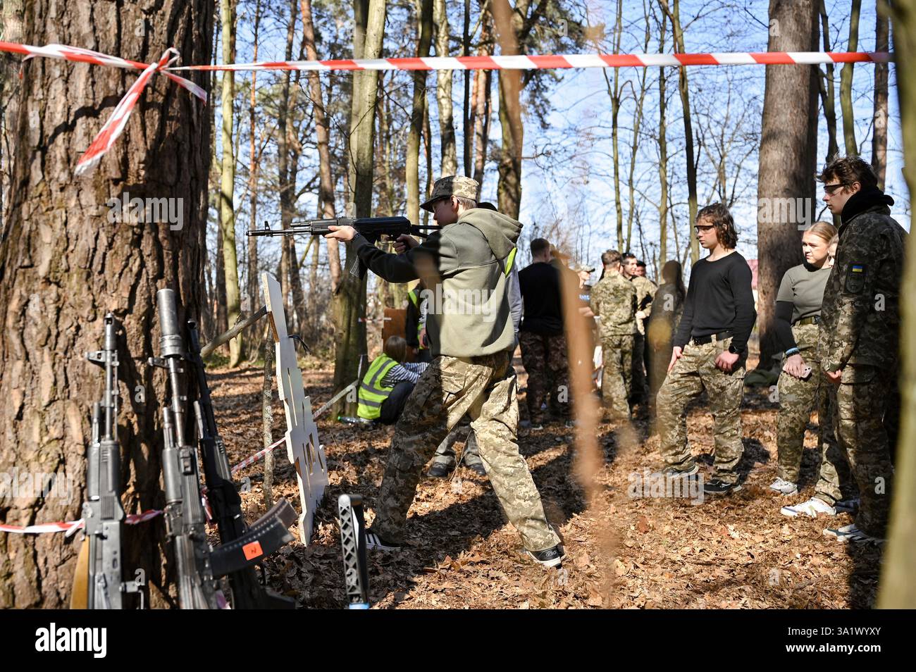 Non Exclusive: A boy in the standing position shoots a rifle during a ...