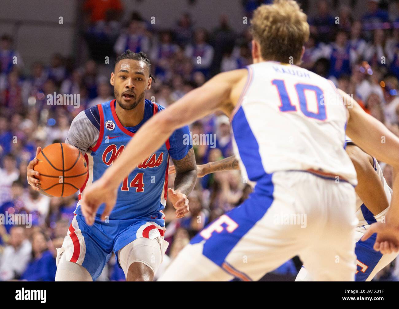 Mississippi guard Dre Davis (14) drives against Florida forward Thomas ...
