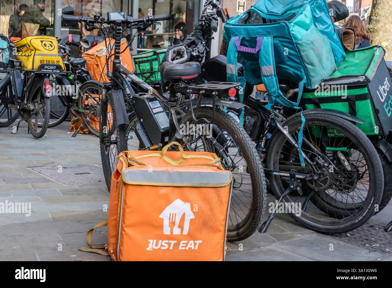 Meal delivery e-bikes parked outside a McDonalds restaurant while ...